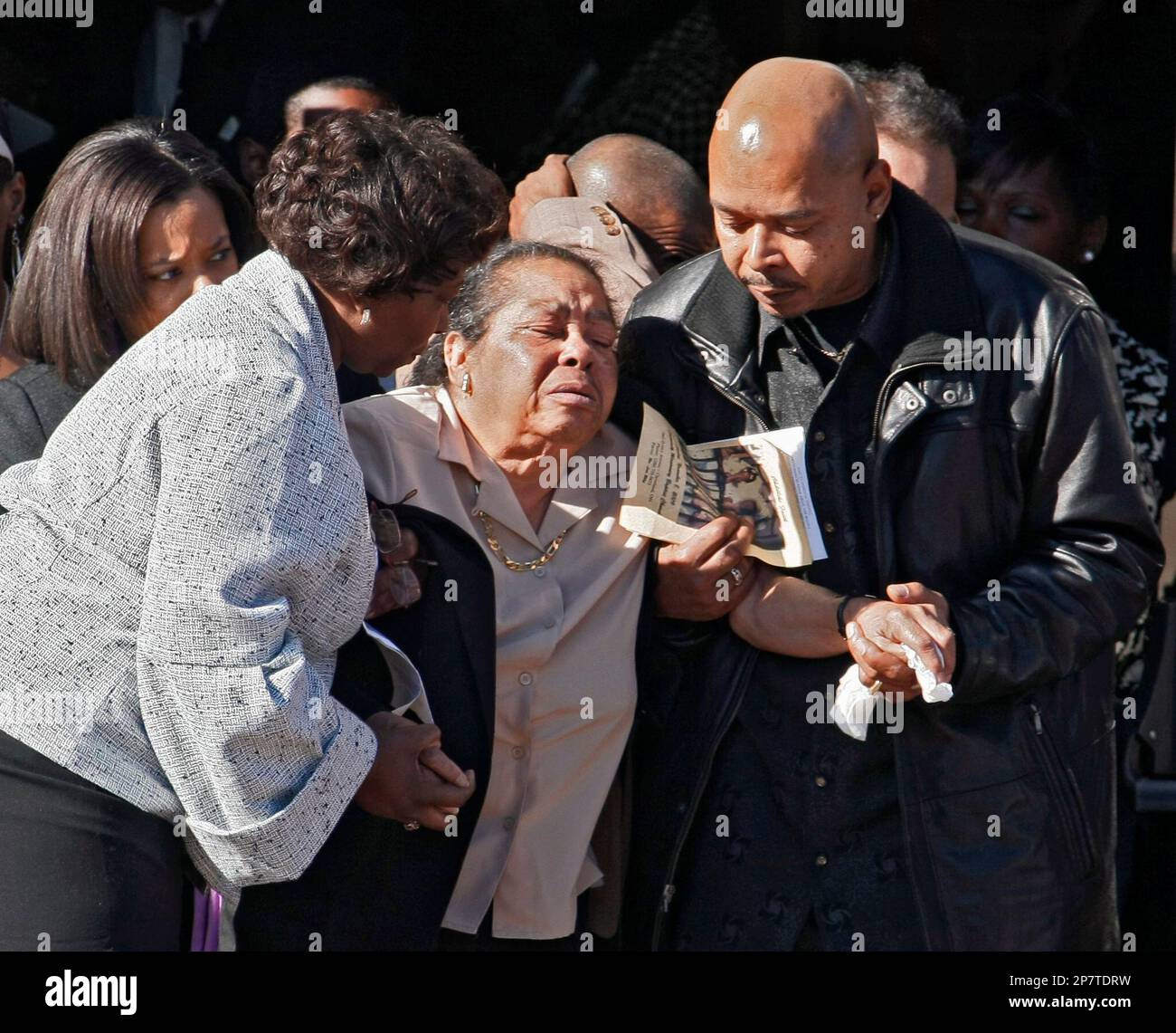 Inez Fortson is helped from funeral of her daughter, Telacia, at Grace ...