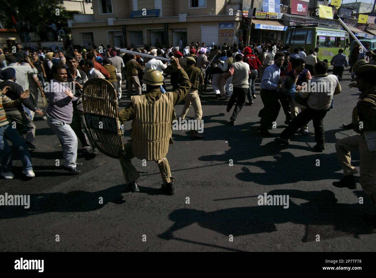 Policemen Baton Charge Government Transporters During A Protest In