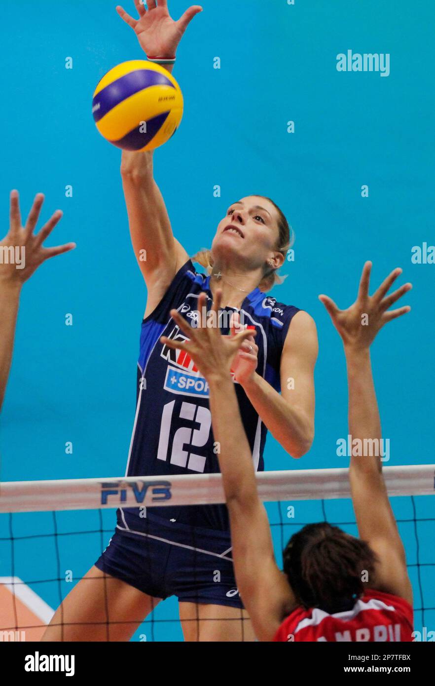 Francesca Piccinini of Italy spikes against Altagracia Mambru of ...