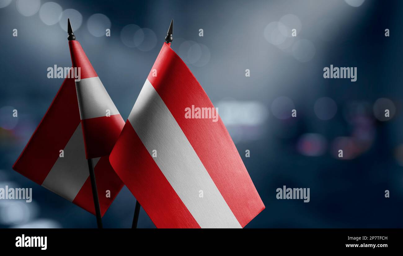 Small flags of the Austria on an abstract blurry background Stock Photo ...