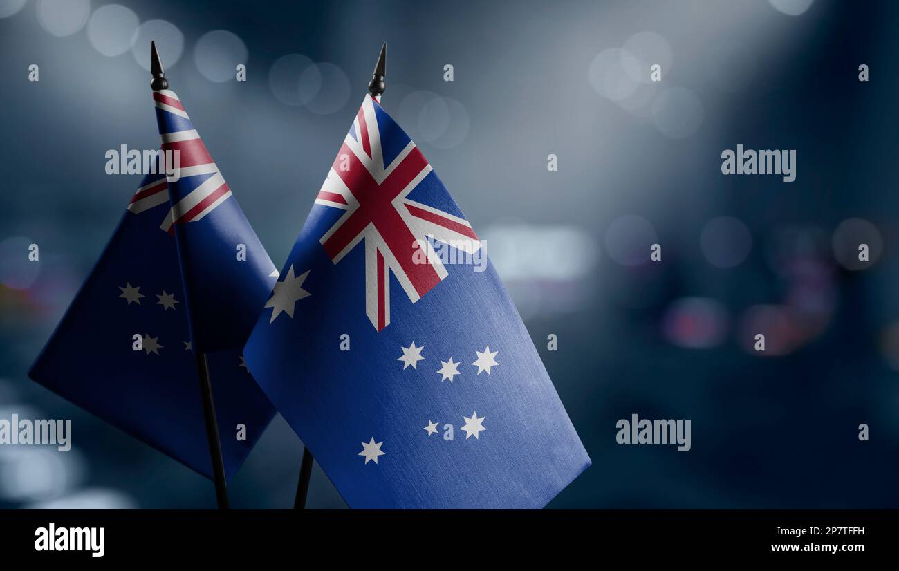 Small flags of the Australia on an abstract blurry background Stock ...