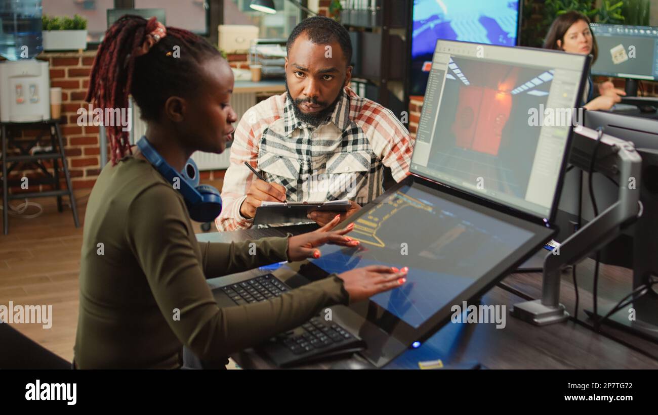 Software company workers team brainstorming game design ideas, looking ...