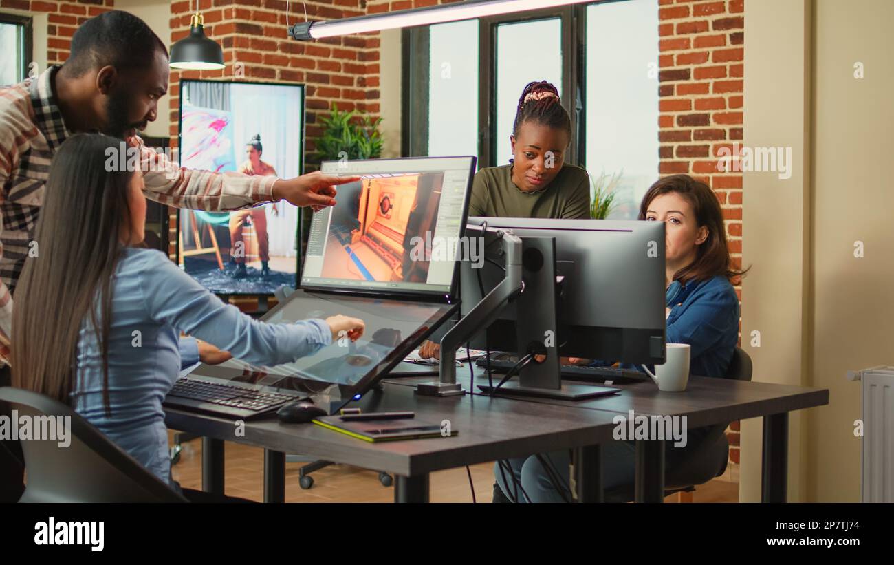 Diverse team of women developing machine component on cad software ...