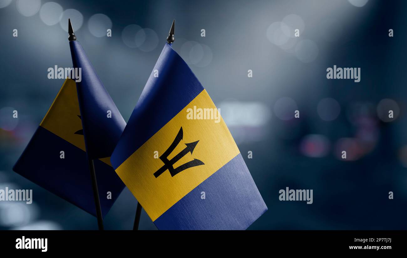 Small flags of the Barbados on an abstract blurry background Stock ...