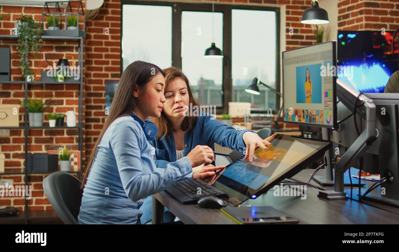 Female content creators editing professional images with retouching ...