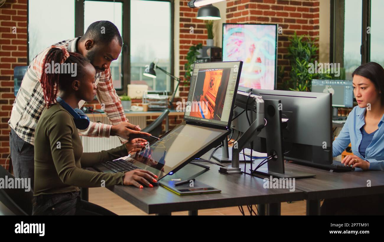 Game industry developers working on artistic development design with ...