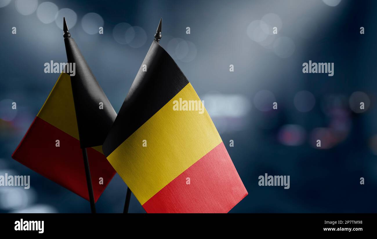 Small flags of the Belgium on an abstract blurry background Stock Photo ...