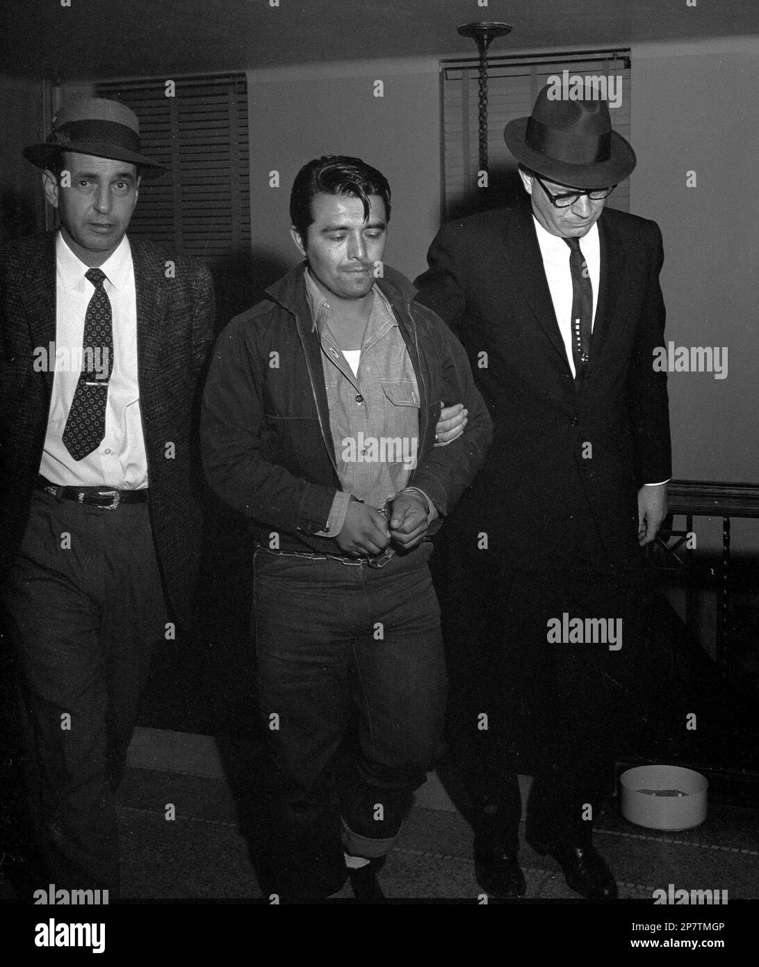 In this Jan. 6, 1960 file photo, Perry Edward Smith is led by police ...