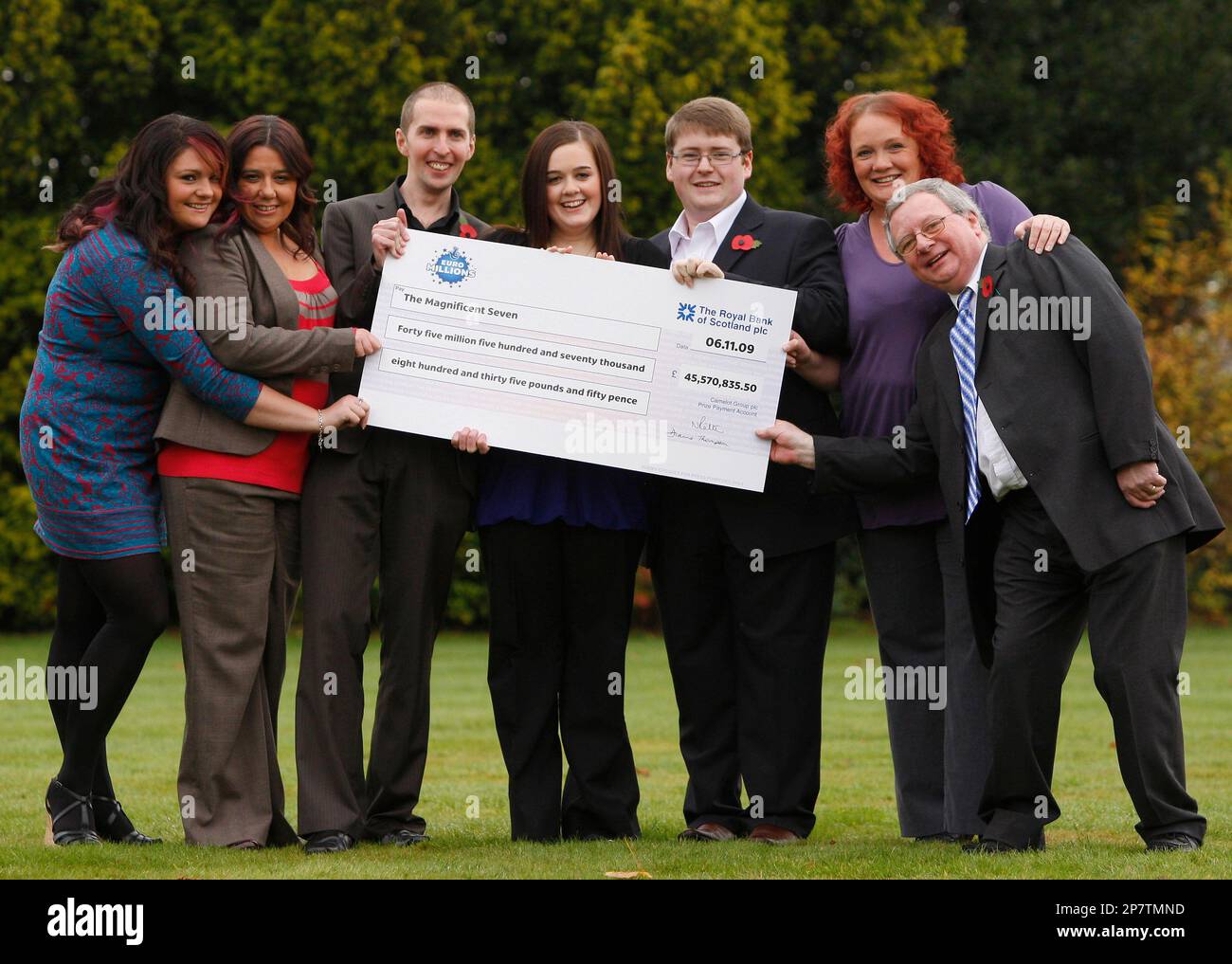 Members of a syndicate of office workers celebrate winning 45.5 million ...