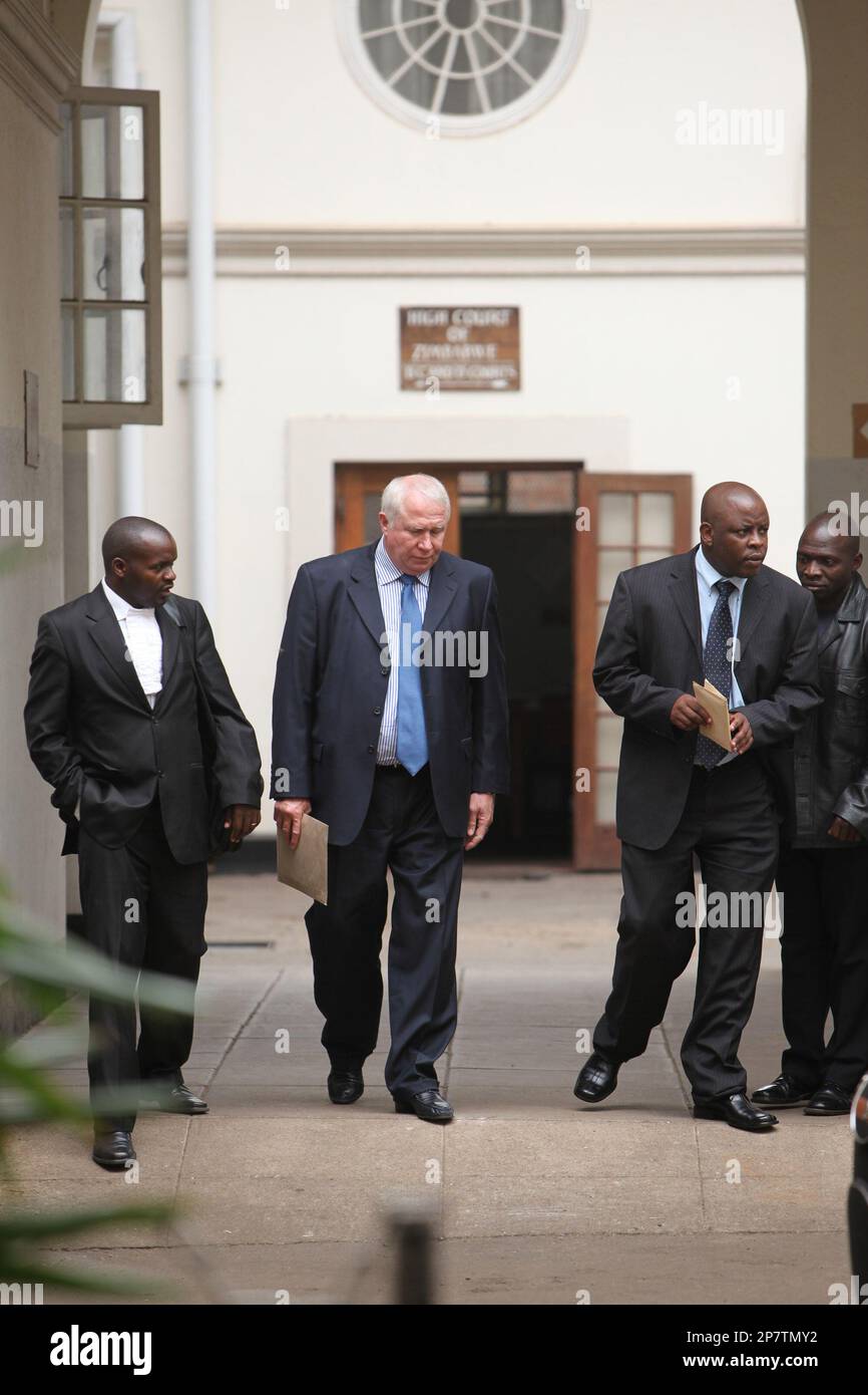 Roy Bennet, centre, and his legal team,on the second day of his trial ...