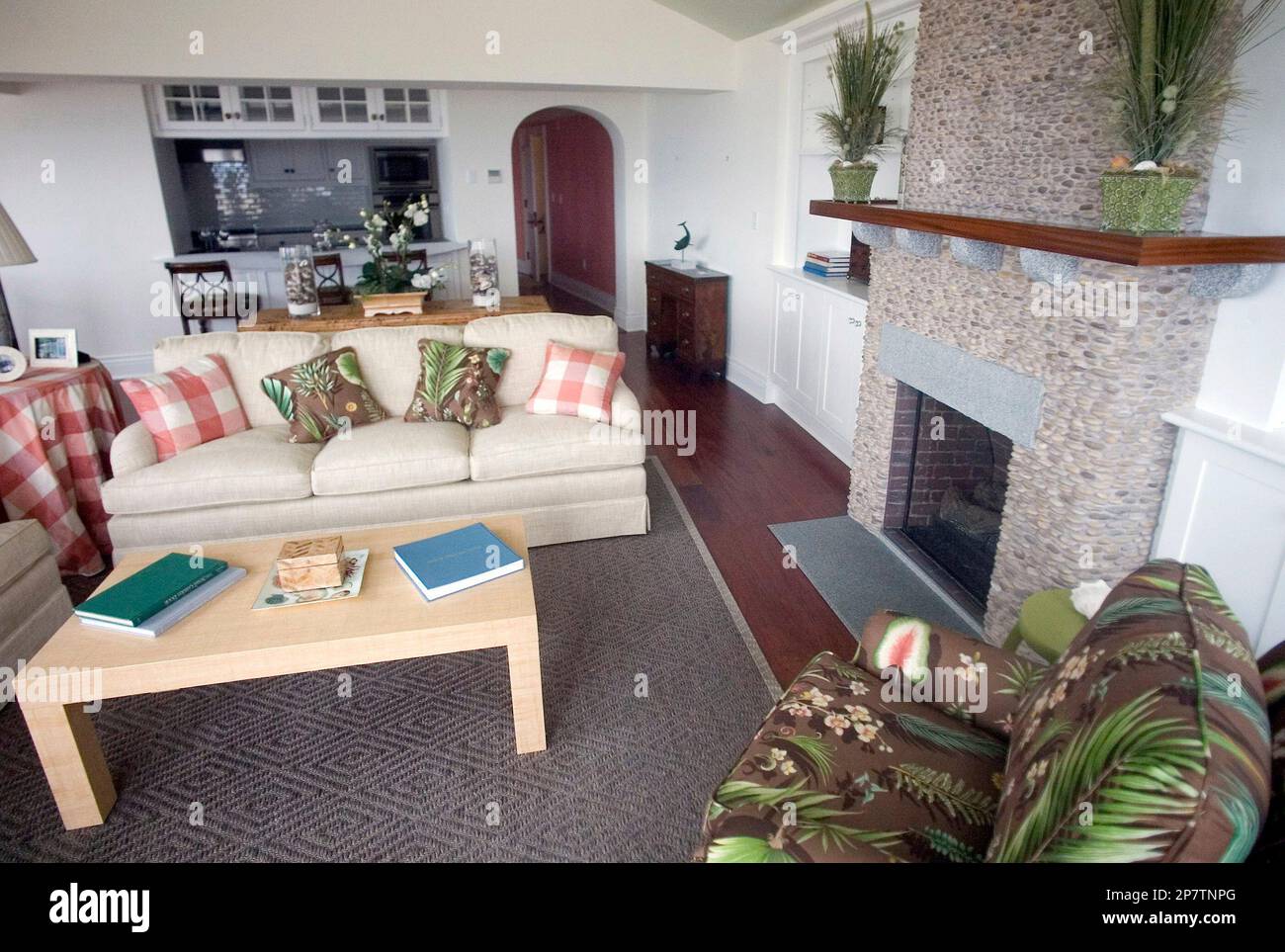 In this Friday, Oct. 23, 2009 photo, the living room and kitchen are on ...