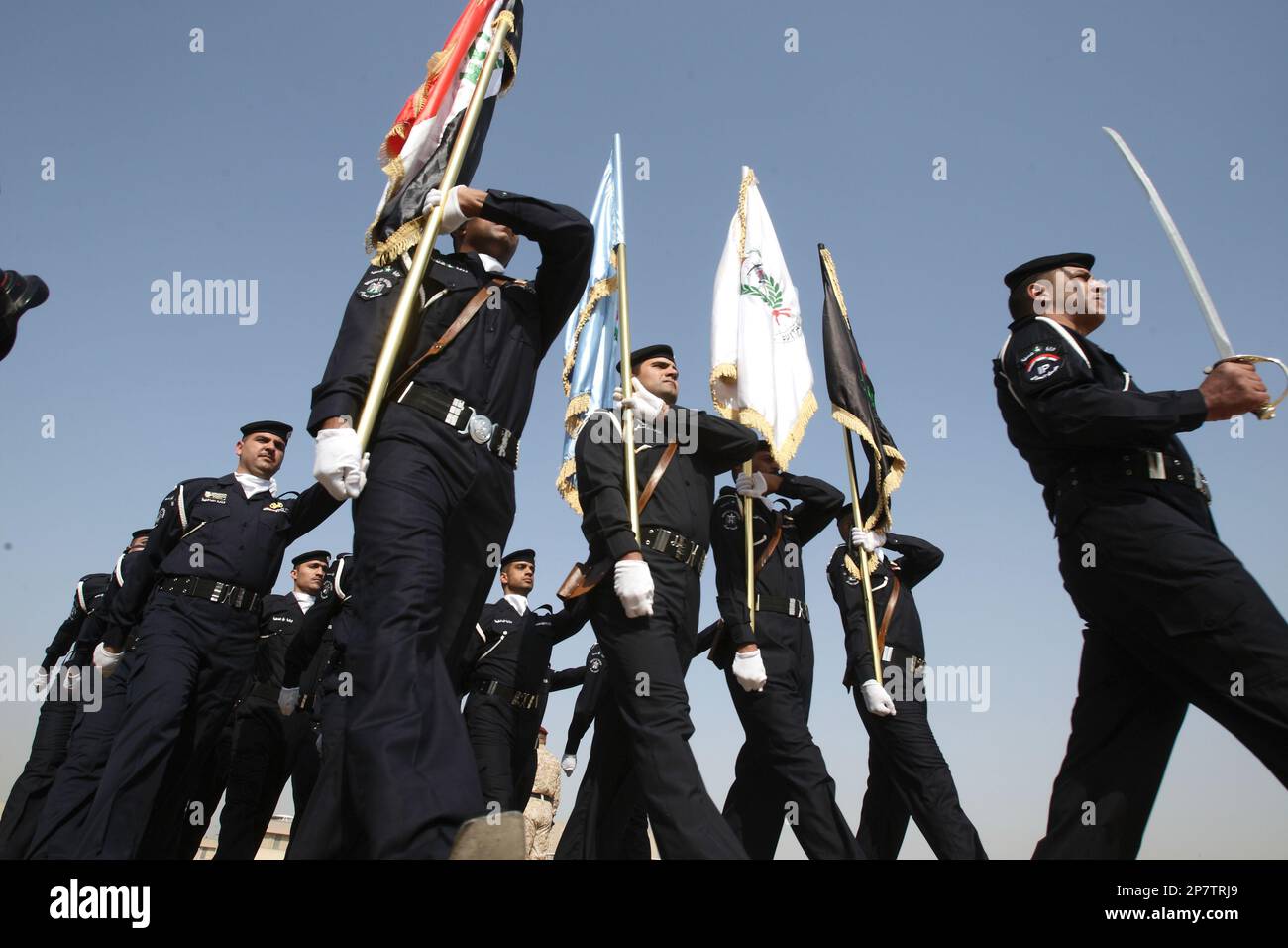Iraqi policemen parade during a Police graduation ceremony,at Baghdad's ...