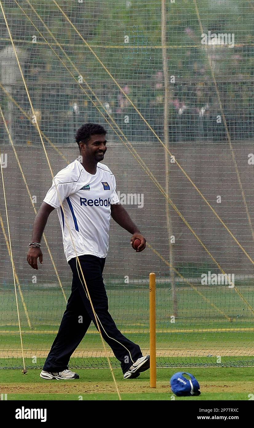 Sri Lanka's Muttiah Muralitharan walks in the nets during the practice session in Mumbai, India ...