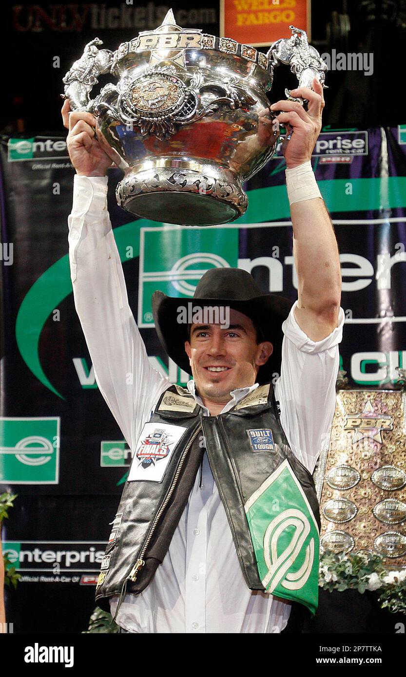 Cody Lostroh hoists the Professional Bull Riders World Finals trophy at ...