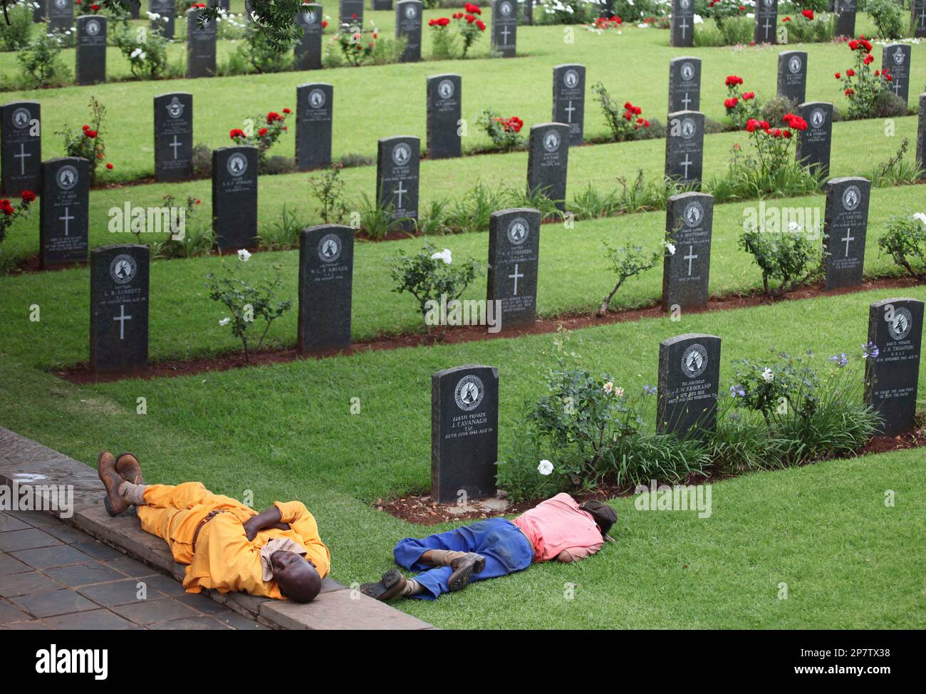In this photo taken Oct. 28, 2009, gardeners rest among gravestones in ...