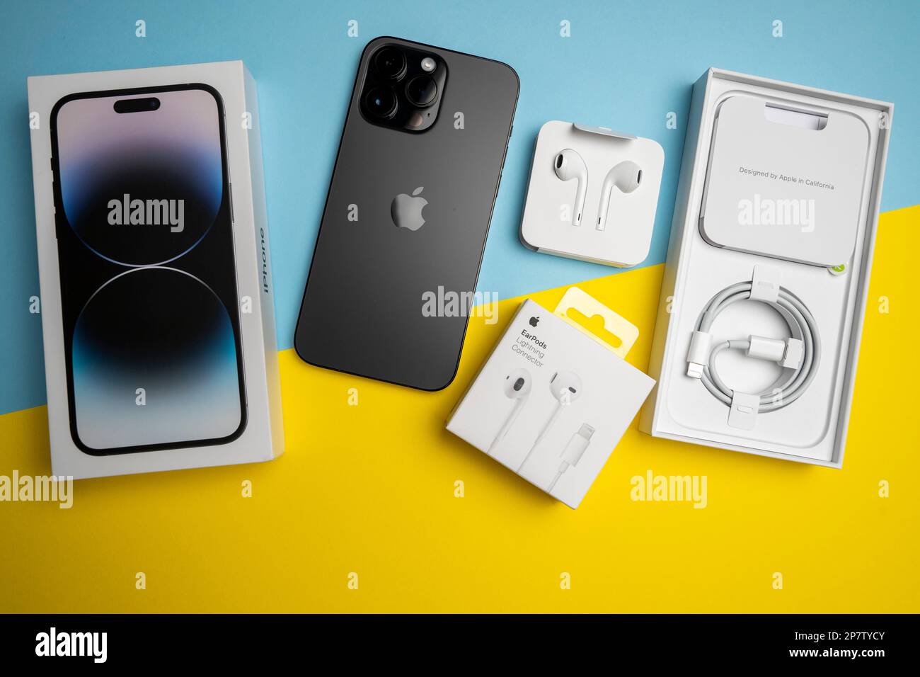 New iPhone 14 pro max and Apple Earpods, Airpods white earphones in an ...