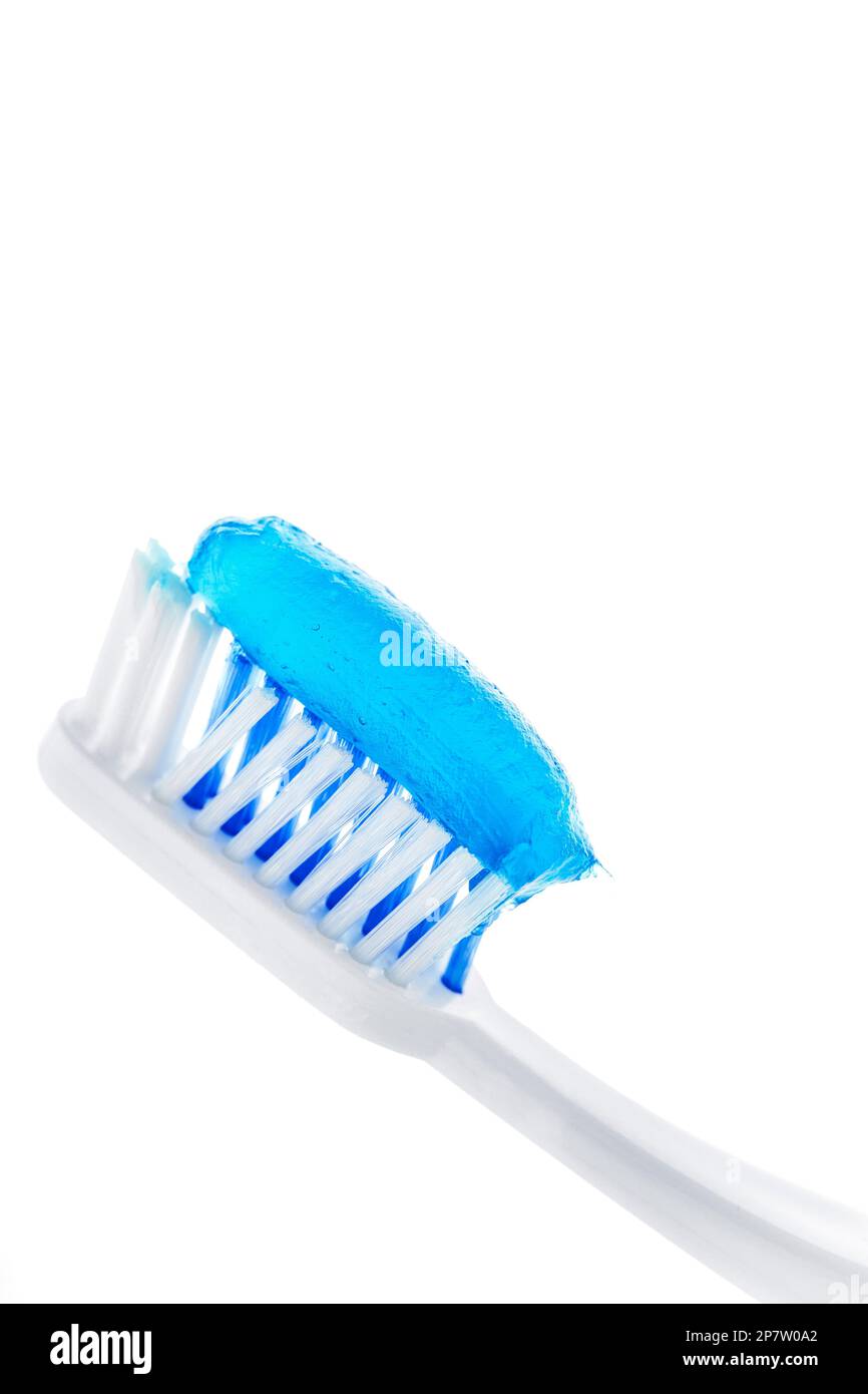 Blue toothpaste on a toothbrush for daily dental cleaning. Still life ...