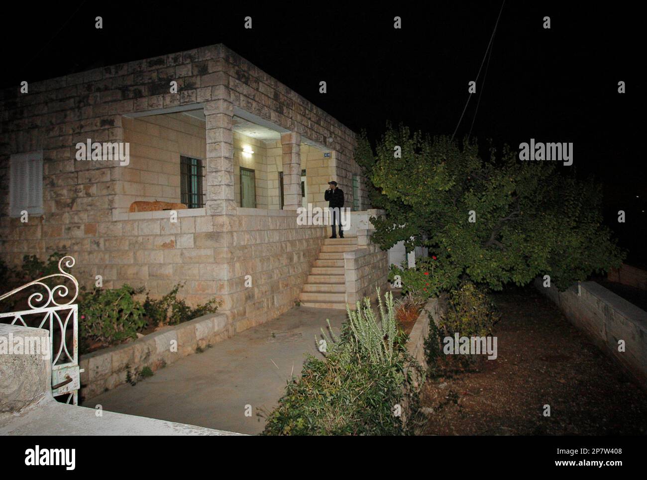 A relative of Maj. Nidal Malik Hasan, stands in front of his home in ...