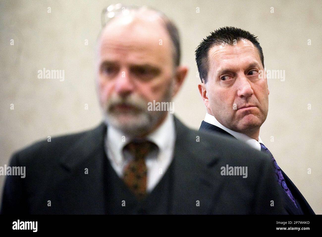 Stephen Strate, right, stands for his initial appearance with attorney ...