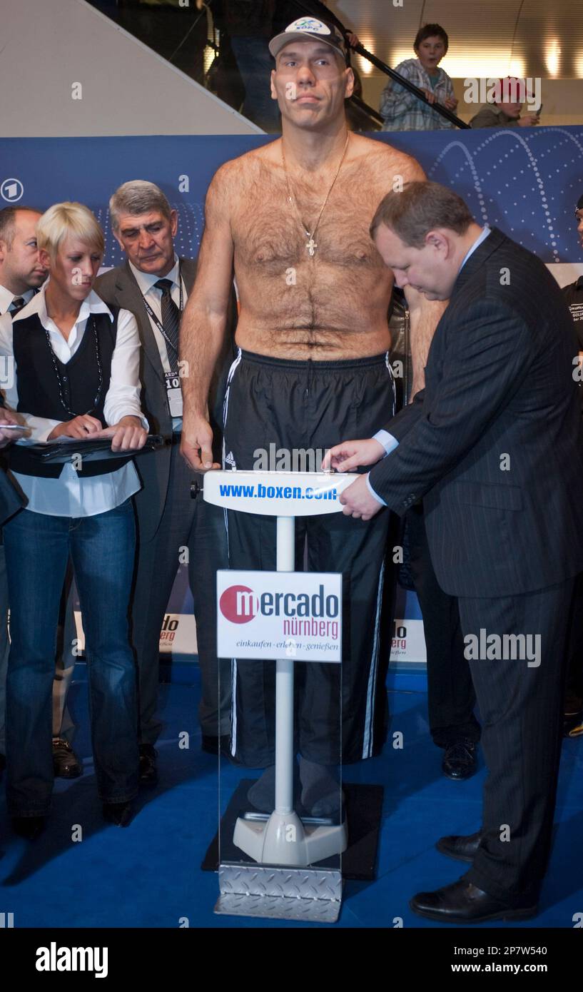 Russian heavyweight boxer Nikolai Valuev poses during the weigh-in at a ...