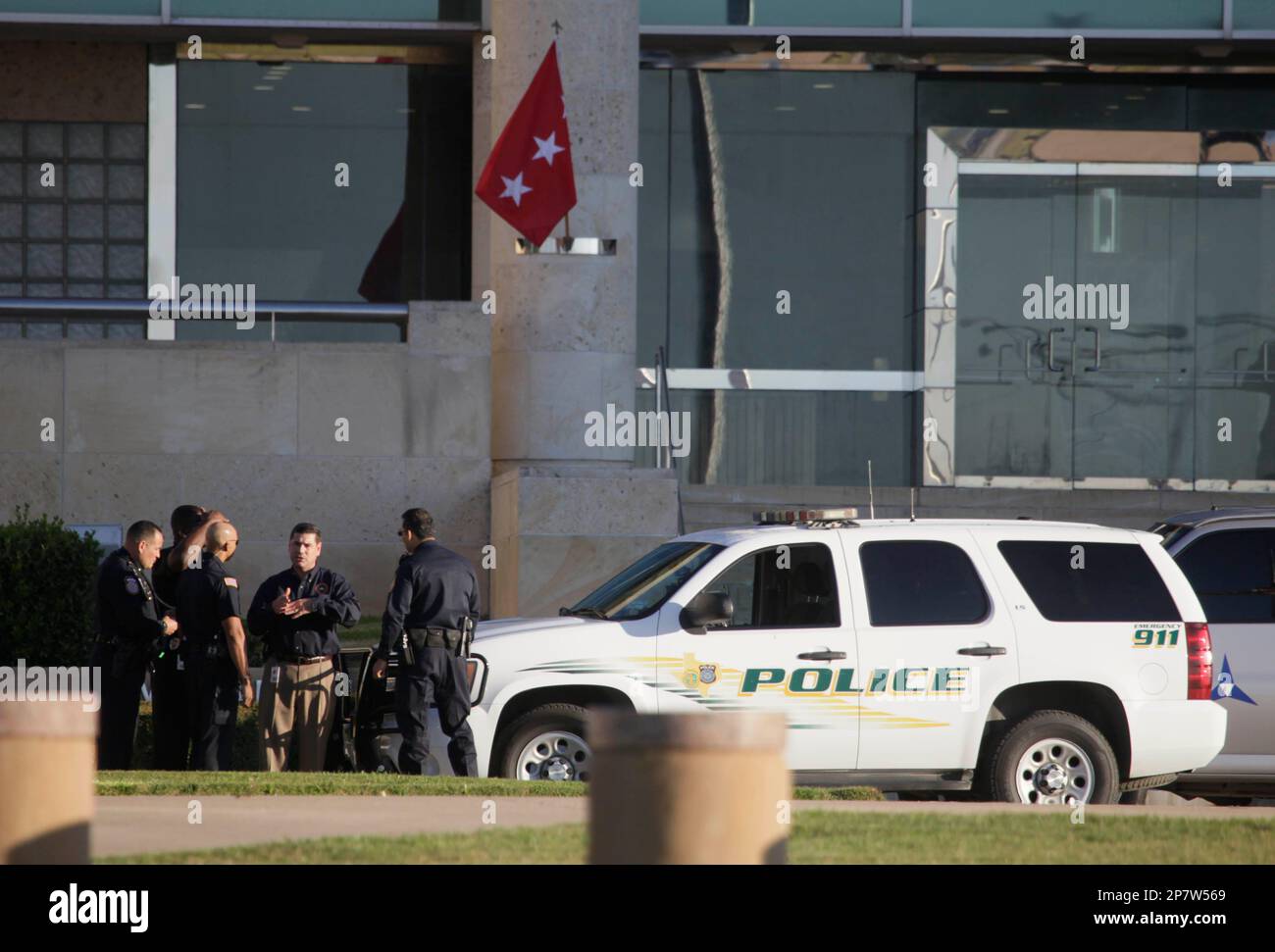 Police officers are gather in front of the Army's III Corps ...