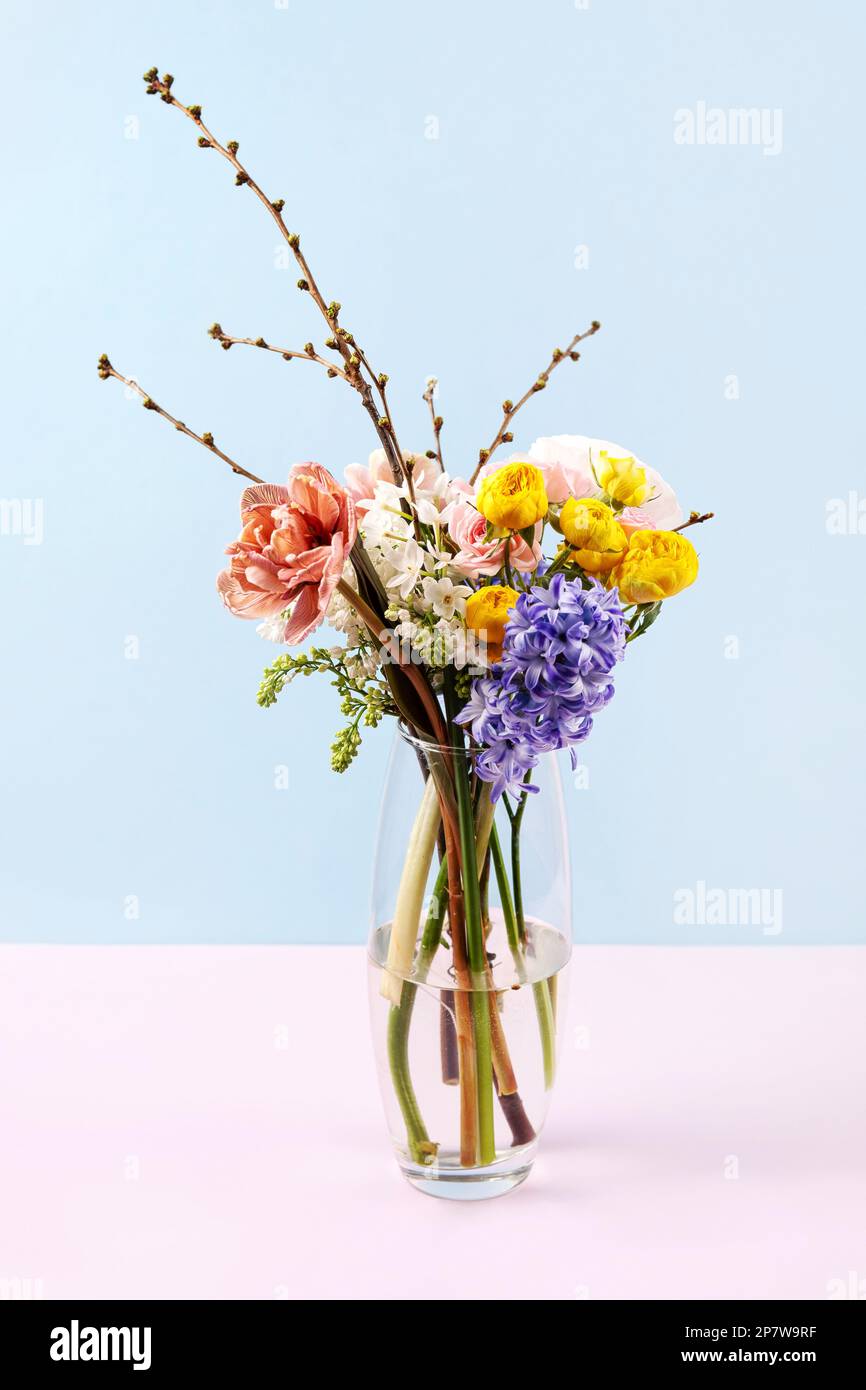 A bright spring bouquet of daffodils, hyacinths, roses, ranunculus ...