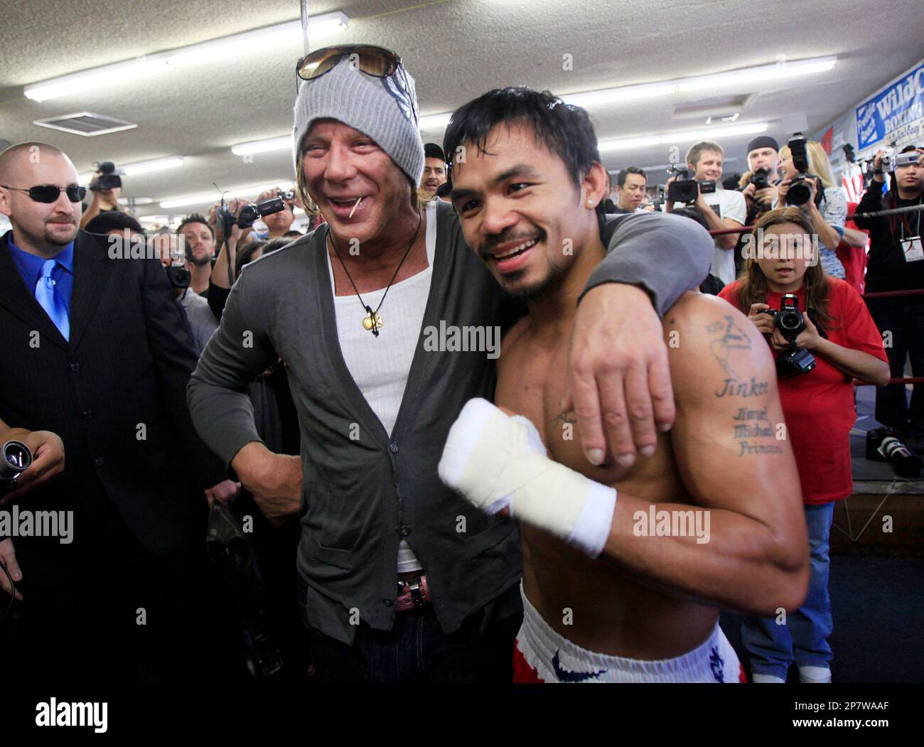 Boxer Manny Pacquiao, right, of the Philippines, poses with actor ...
