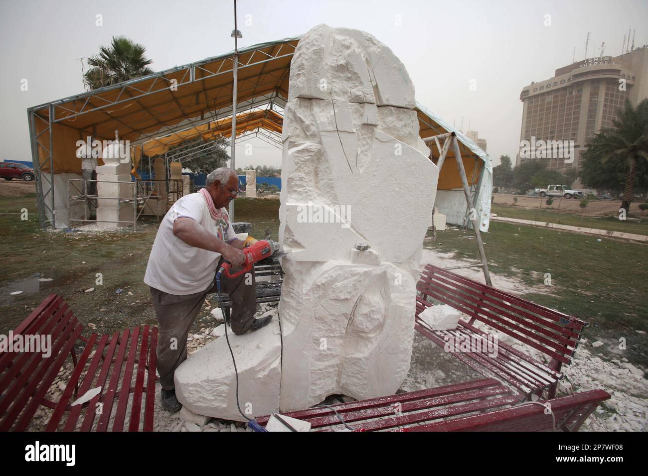 Iraqi Artist Alaa al- Hamdan is carving a huge stone sculpture in ...