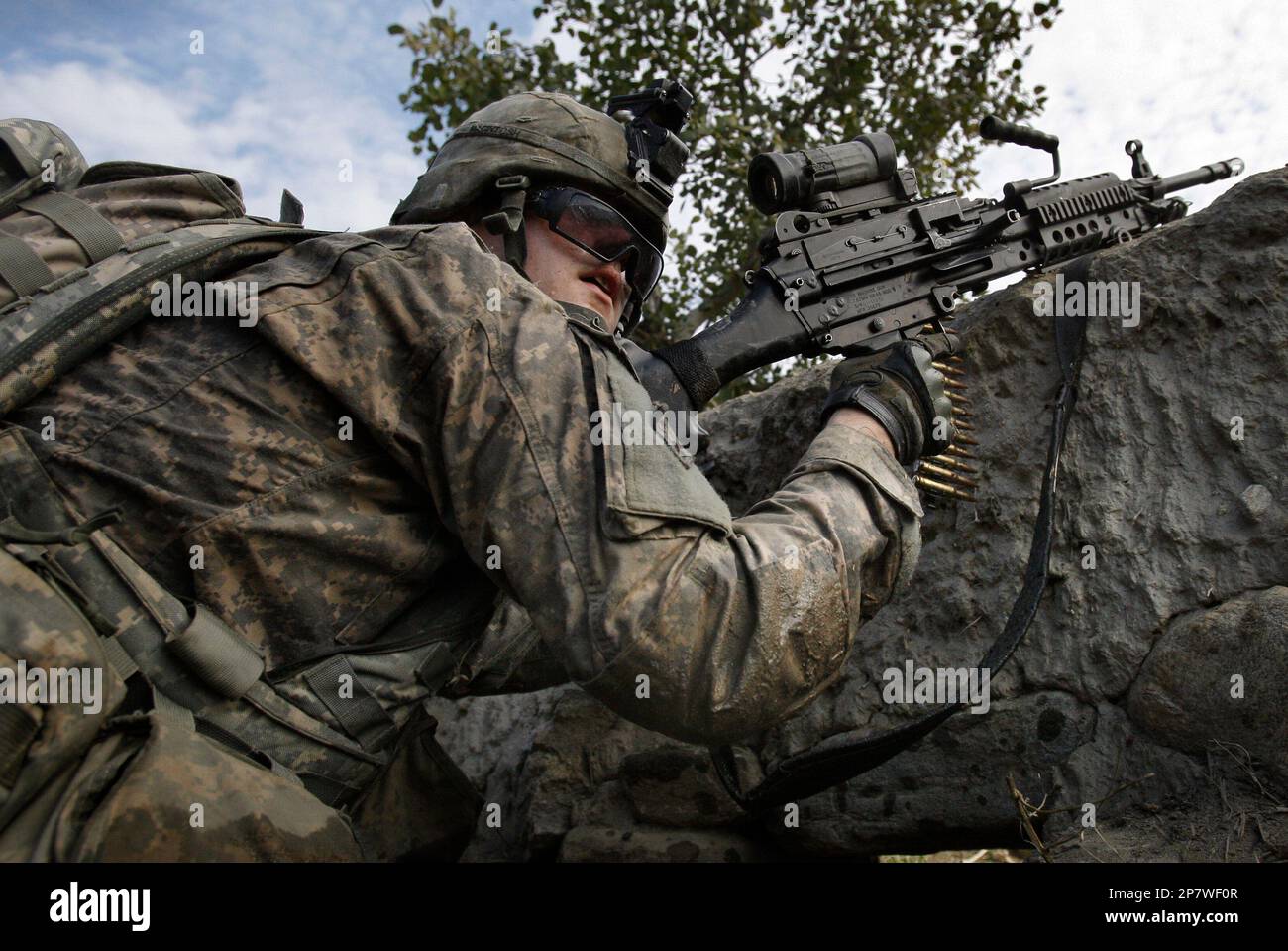 U.S. Army PV2 John MacIntosh flips his sunglasses down as they fog over ...