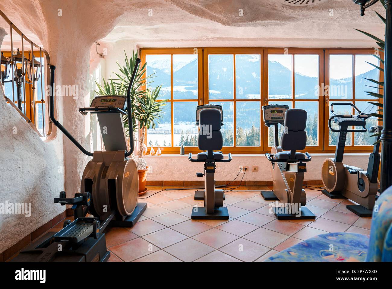 Running exercise equipment in front of windows in luxury hotel Stock ...