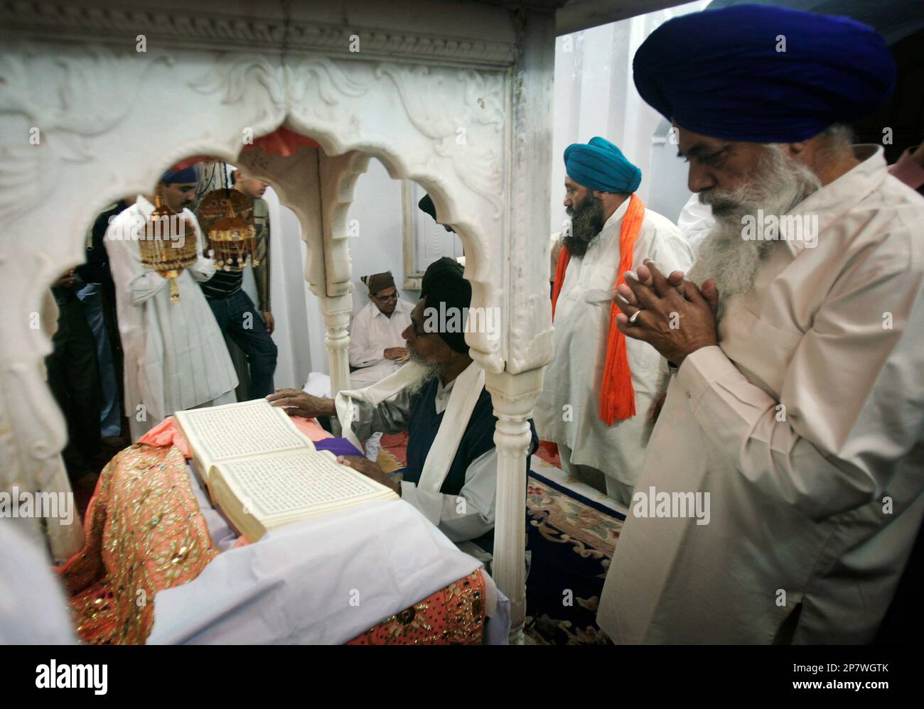 Indian Sikh pilgrims attend a religious congregation at Nankana Sahib ...