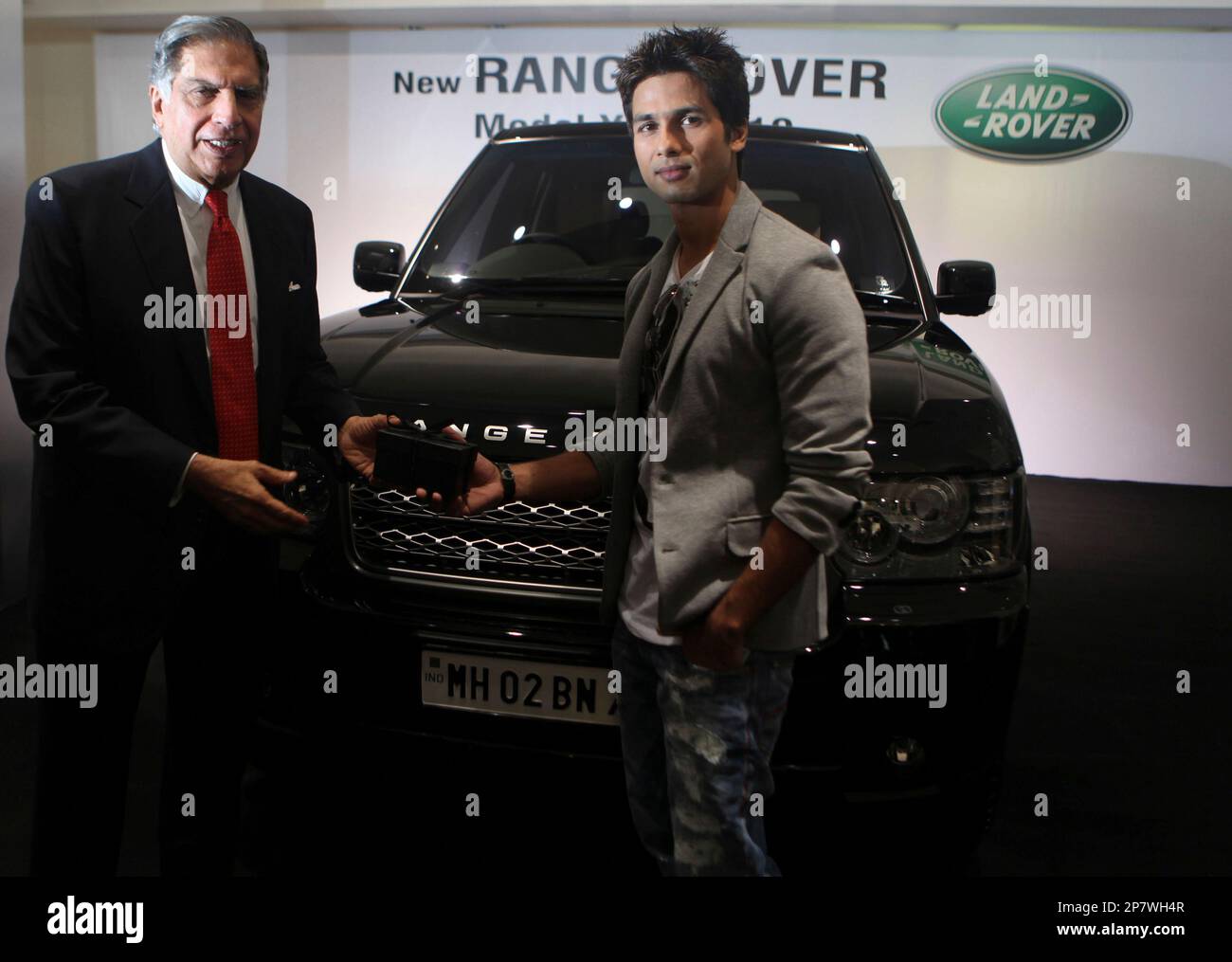 Tata Motors Chairman Ratan Tata, left, hands over the keys of a Range ...