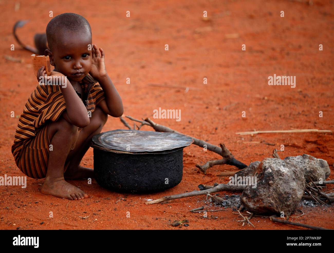 This Oct. 22, 2009 photo shows a Somali Kenyan boy eating a biscuit ...