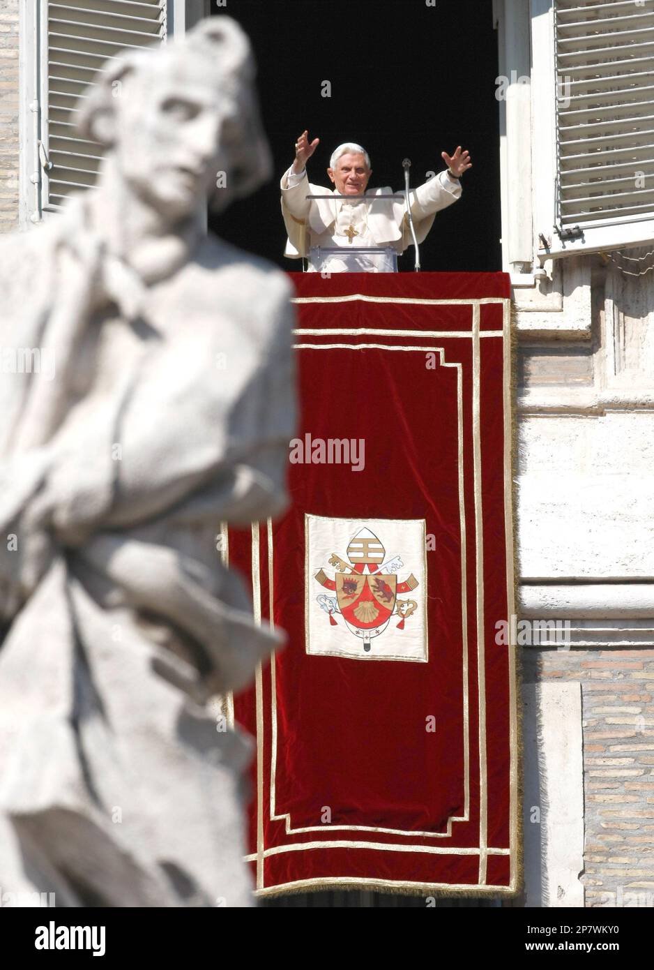 Pope Benedict XVI waves at faithful during the Angelus prayer on All ...