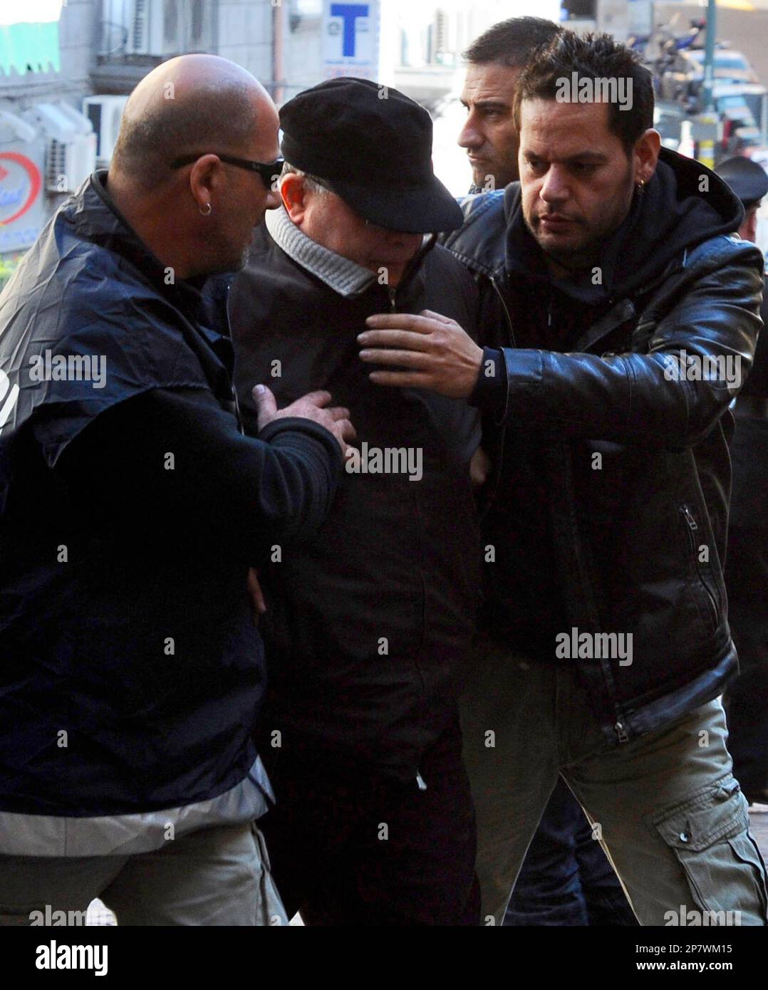 A man identified by carabinieri paramilitary police as suspect mobster Pasquale Russo, center ...