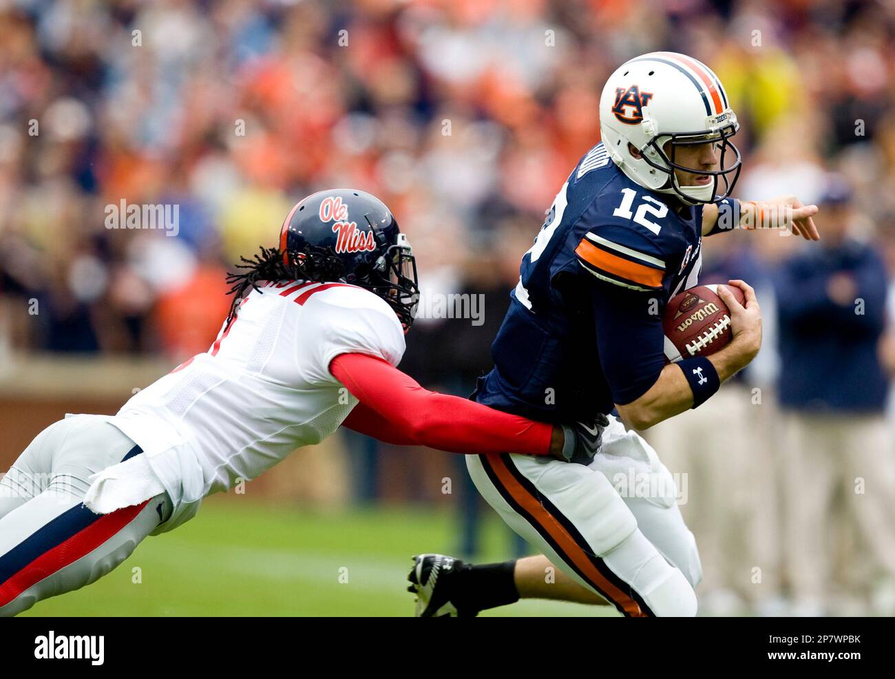 Auburn quarterback Chris Todd (12) scrambles for a first down around ...