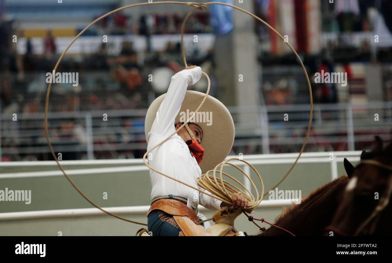 A Mexican cowboy or Charro practices with his lasso during the ...