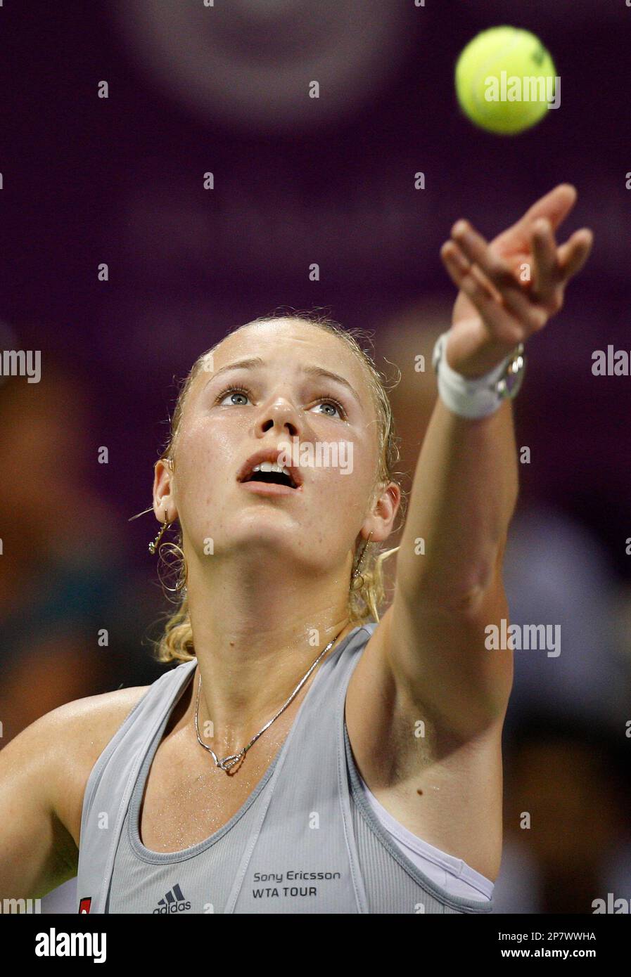 Caroline Wozniacki of Denmark serves to Jelena Jankovic of Serbia ...