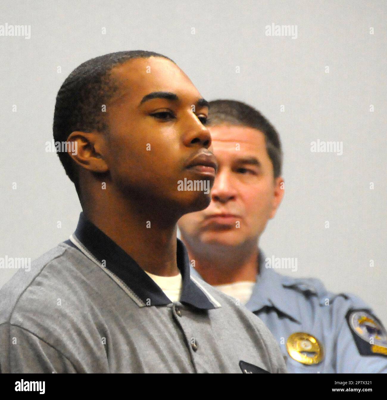 John William Lomax III, center, is arraigned on charges connected with ...
