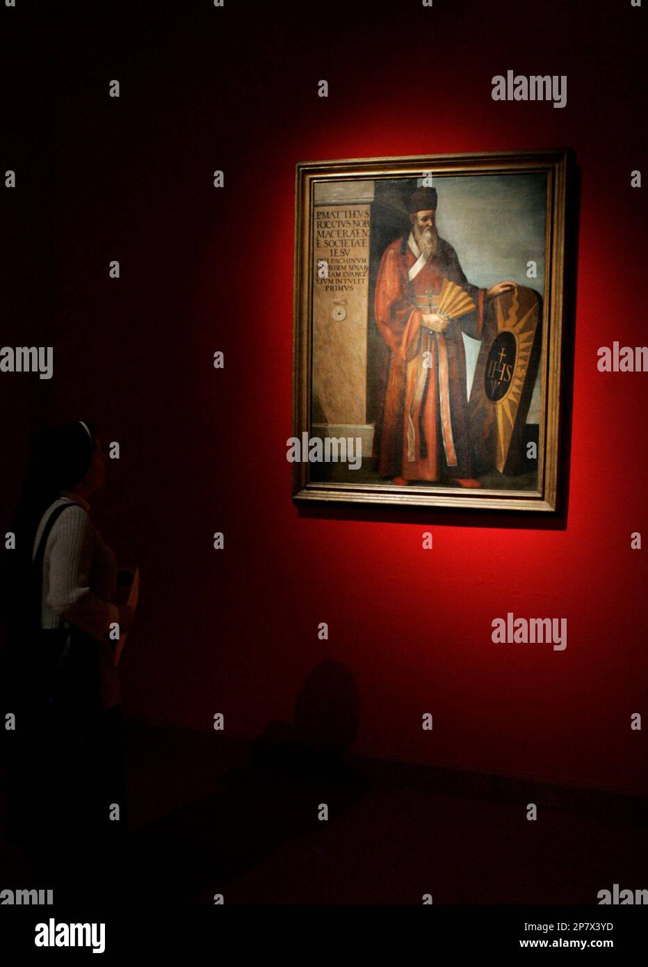 A nun looks at an anonymous painting, dating back to the 17th century ...