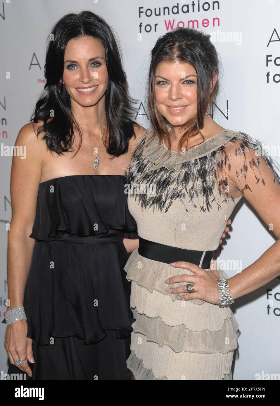 Actress Courteney Cox, left, and singer Stacy "Fergie" Ferguson attend ...