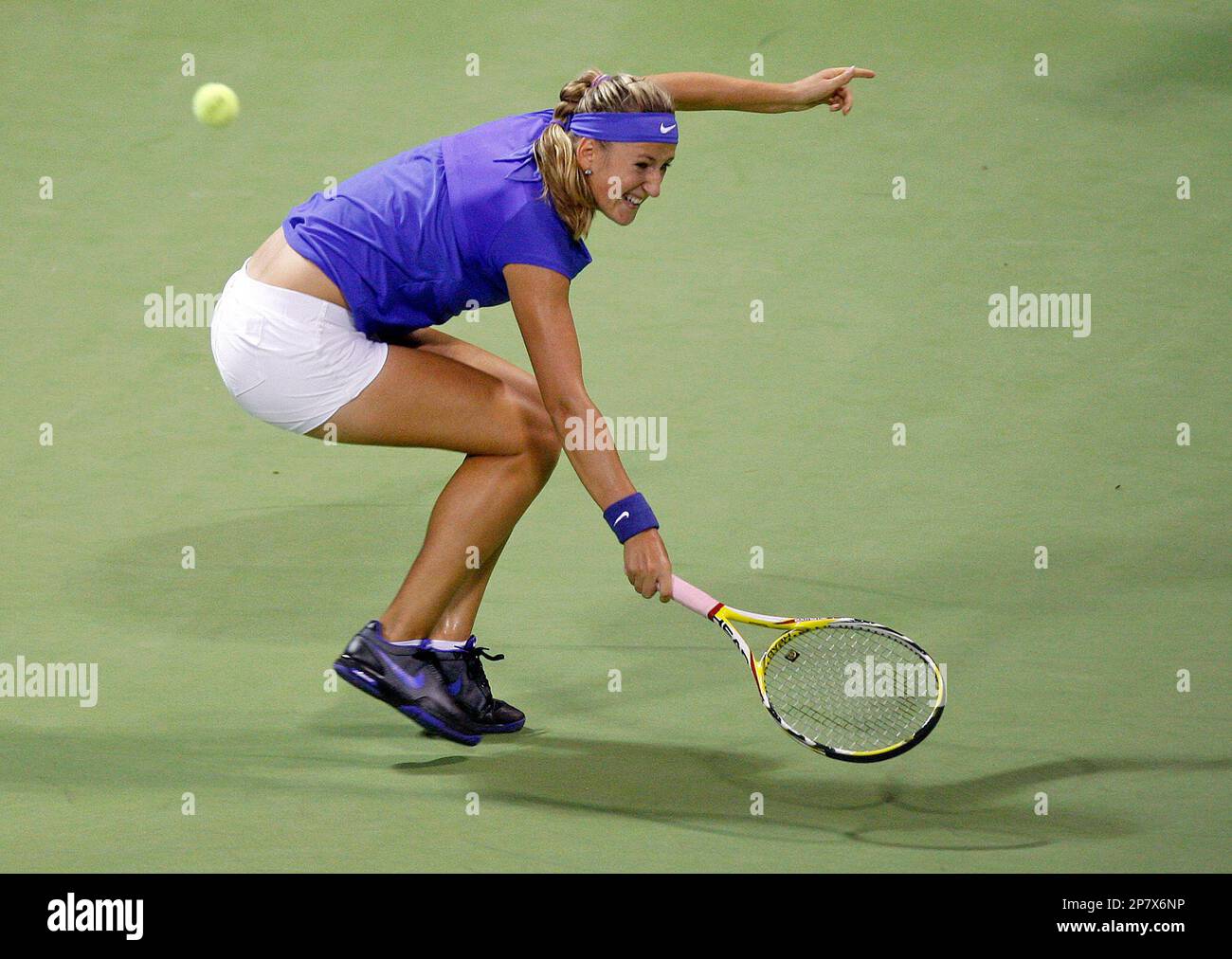 Victoria Azarenka of Belarus returns a ball to Jelena Jankovic of ...