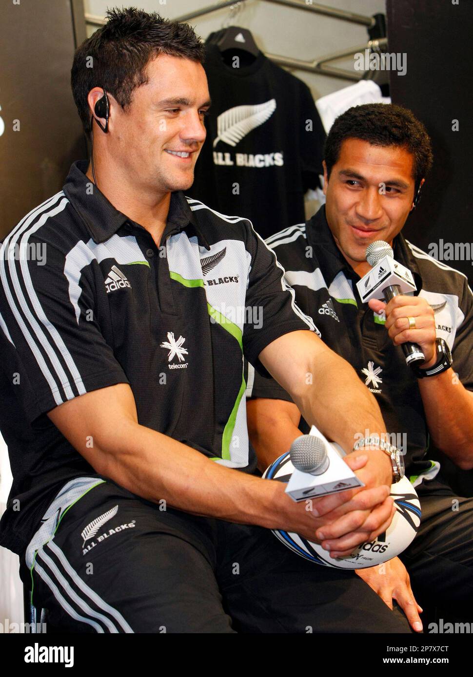 New Zealand's All Blacks Mils Muliaina, right, speaks with Dan Carter ...