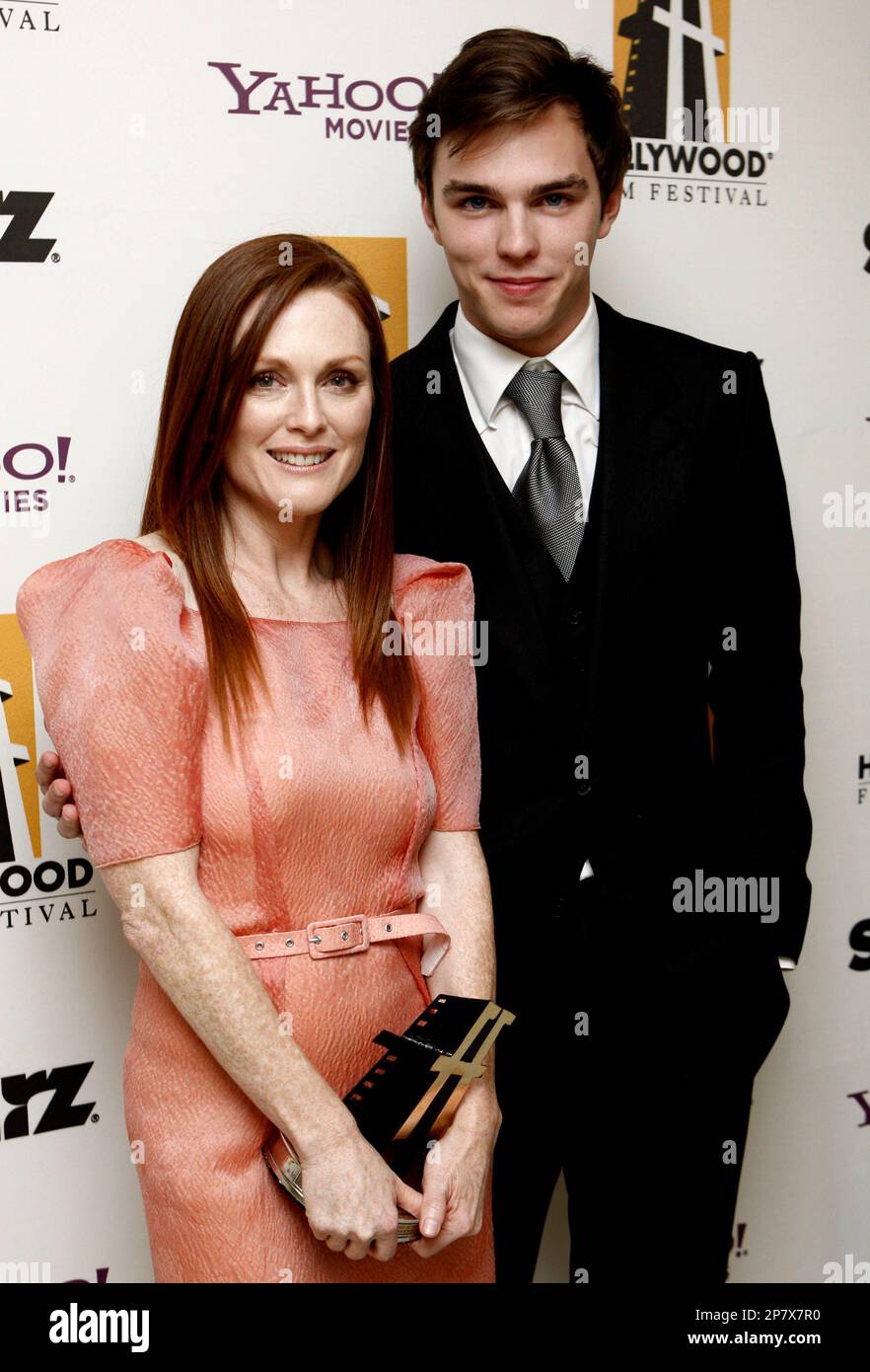 Julianne Moore, left, and presenter Nicholas Hoult are seen backstage ...