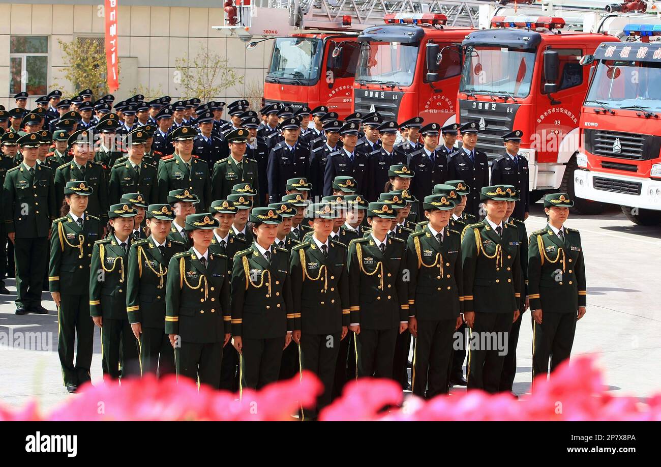 Fire fighters and policemen attend the establishing ceremony of China's ...