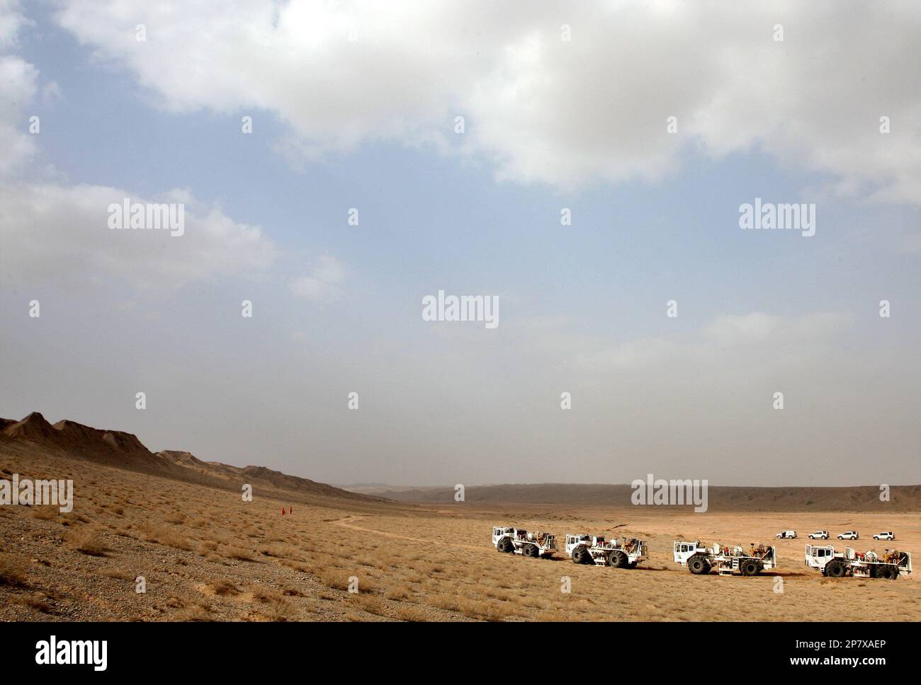 Workers of PetroChina Tarim Oilfield use earthquake detecting vehicles ...