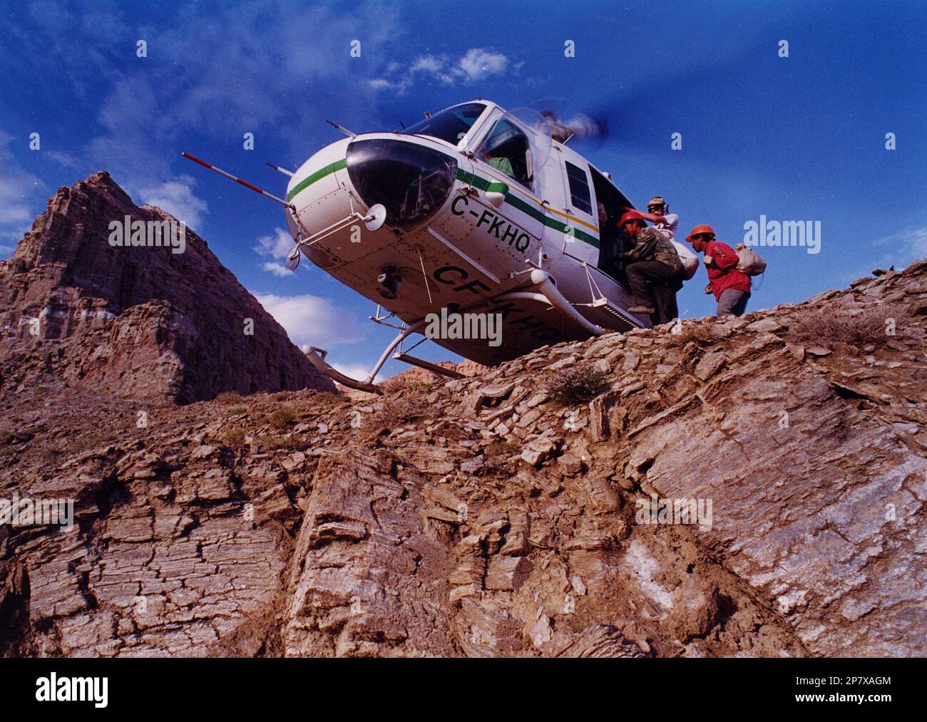 Workers board a helicopter to prospect for oilfield at the PetroChina's ...