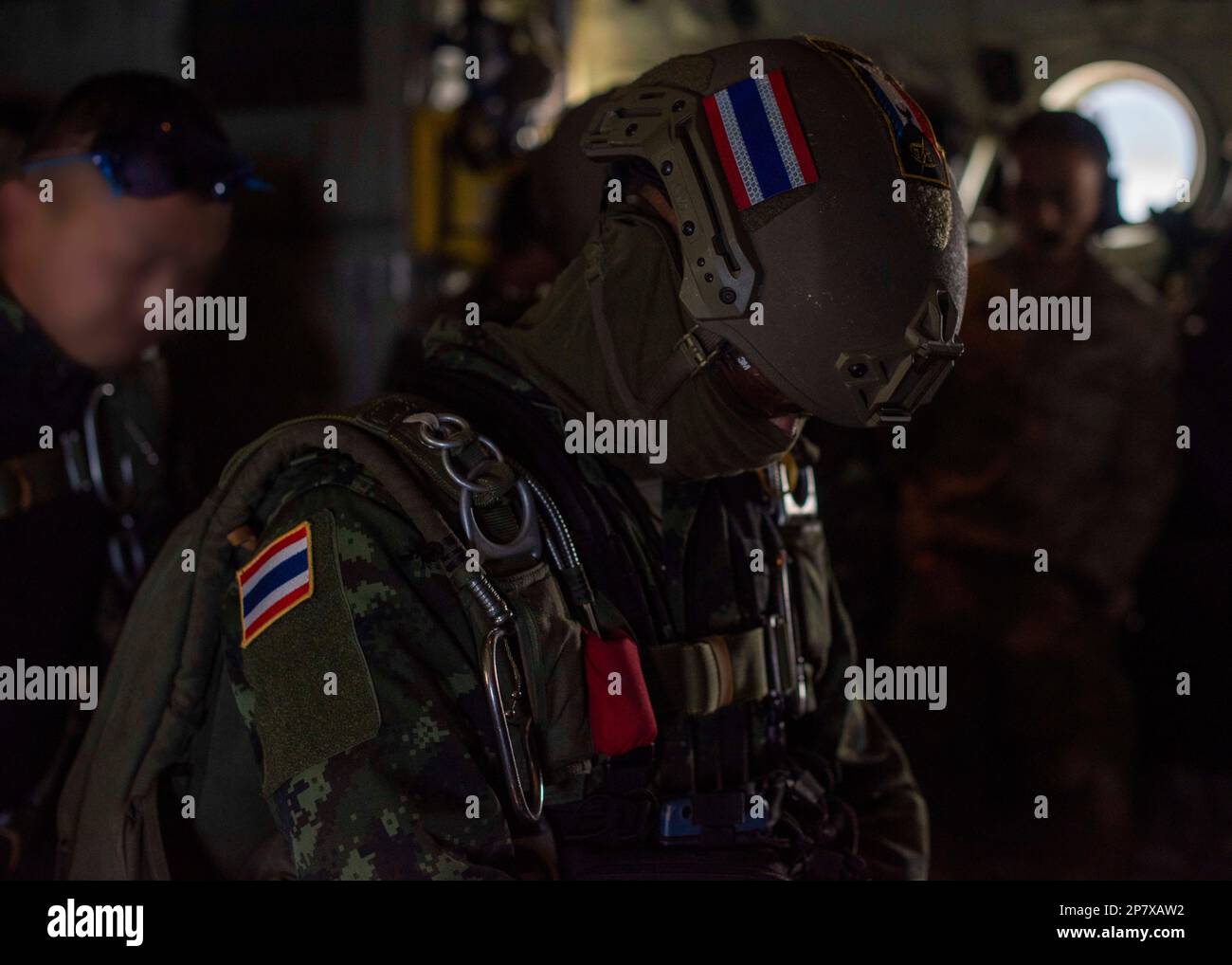 A Royal Thai Army Special Forces member prays prior to jumping from a ...