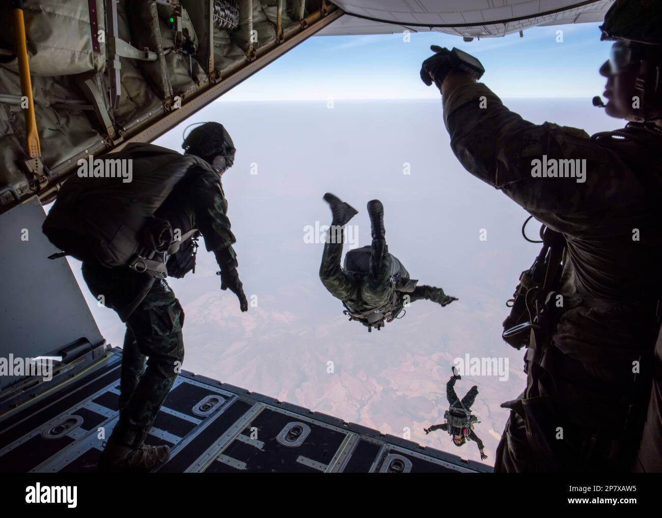 Royal Thai Army Special Forces members jump out of a 353rd Special ...