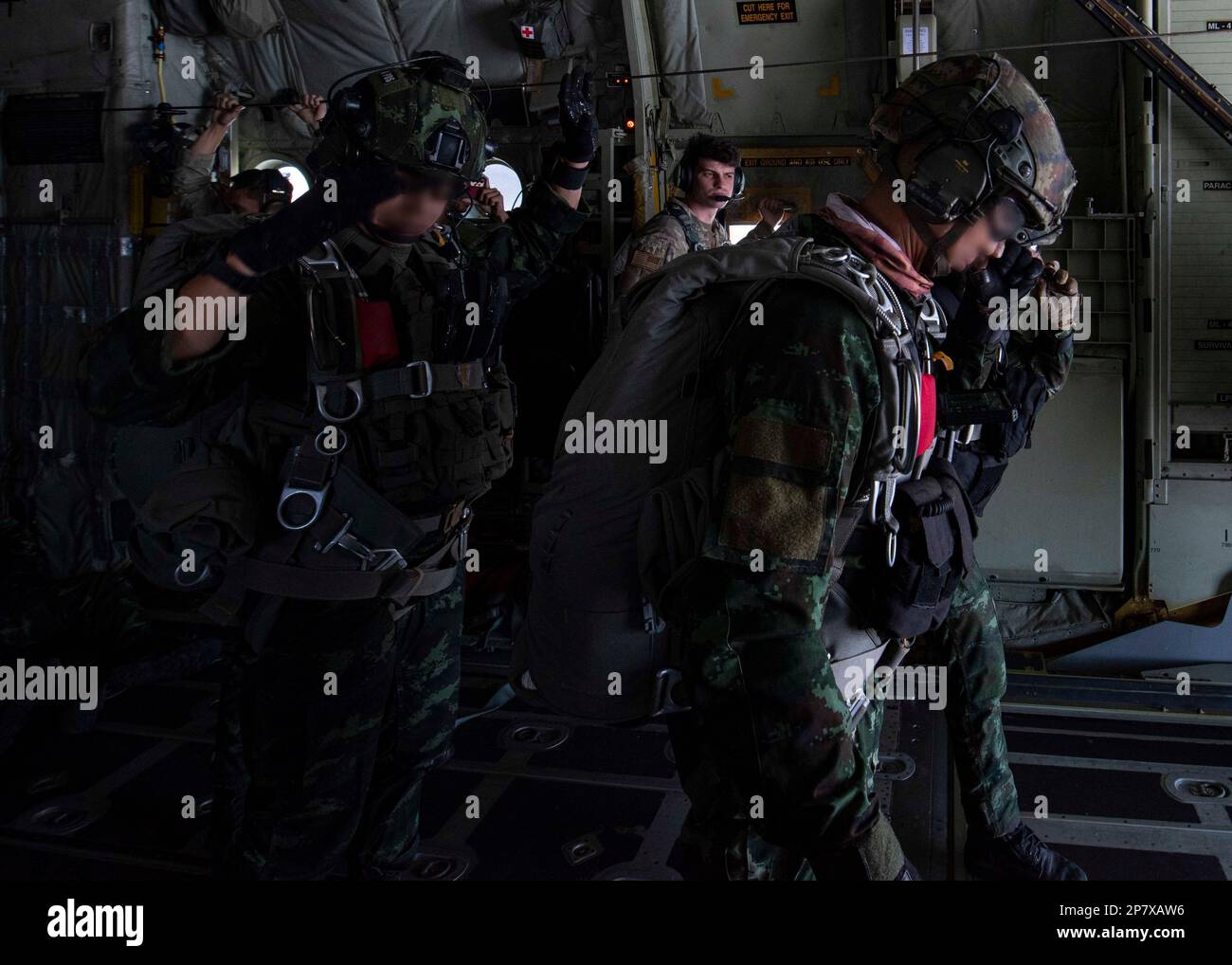 Royal Thai Army Special Forces members prepare to jump from a 353rd ...